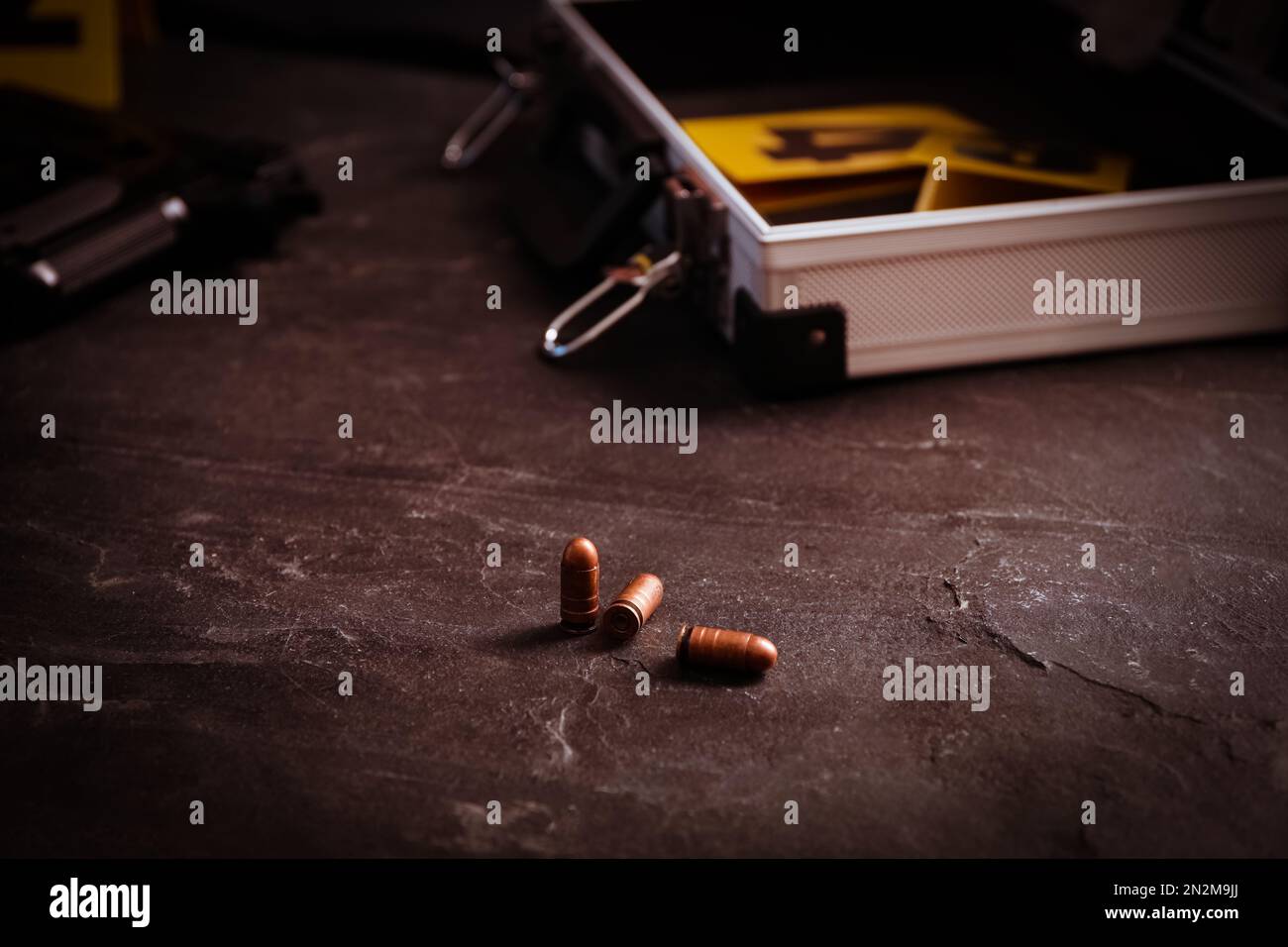 Bullets on black slate table, closeup. Crime scene Stock Photo - Alamy