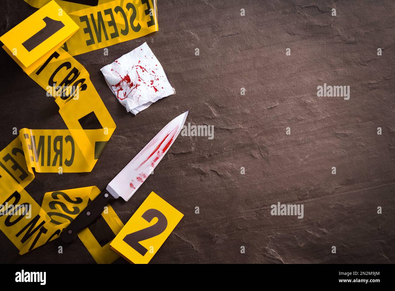 Flat lay composition with evidences on black slate background, space ...