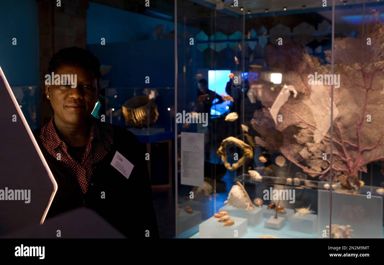 Miranda Lowe, collection manager poses for a photograph next to an ...