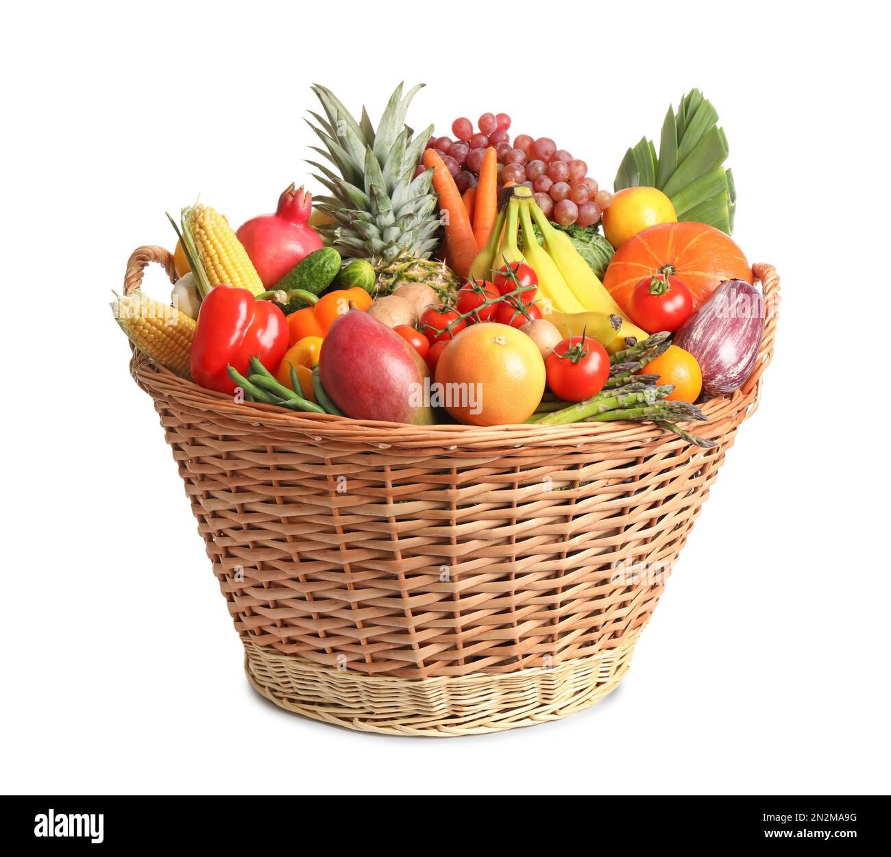 Basket with assortment of fresh organic fruits and vegetables on white ...