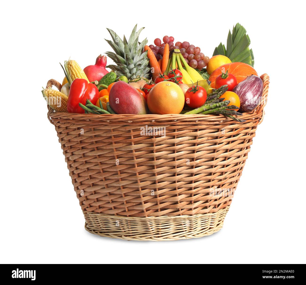 Basket with assortment of fresh organic fruits and vegetables on white ...