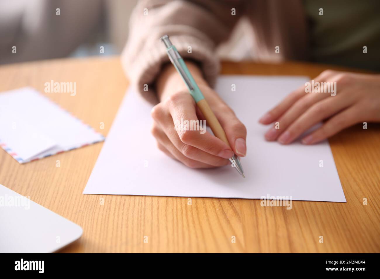 Woman writing letter with envelope hi-res stock photography and images ...