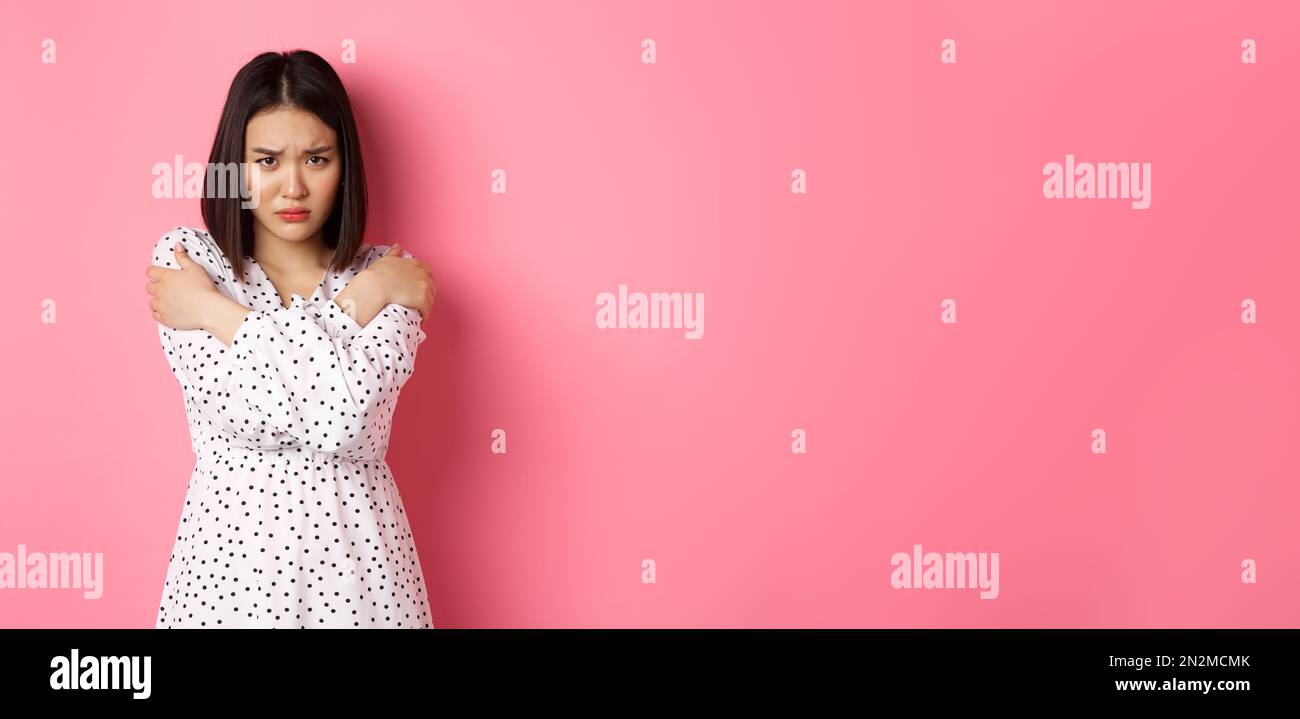 Timid and offended asian girl cross arms on chest, staring defensive ...