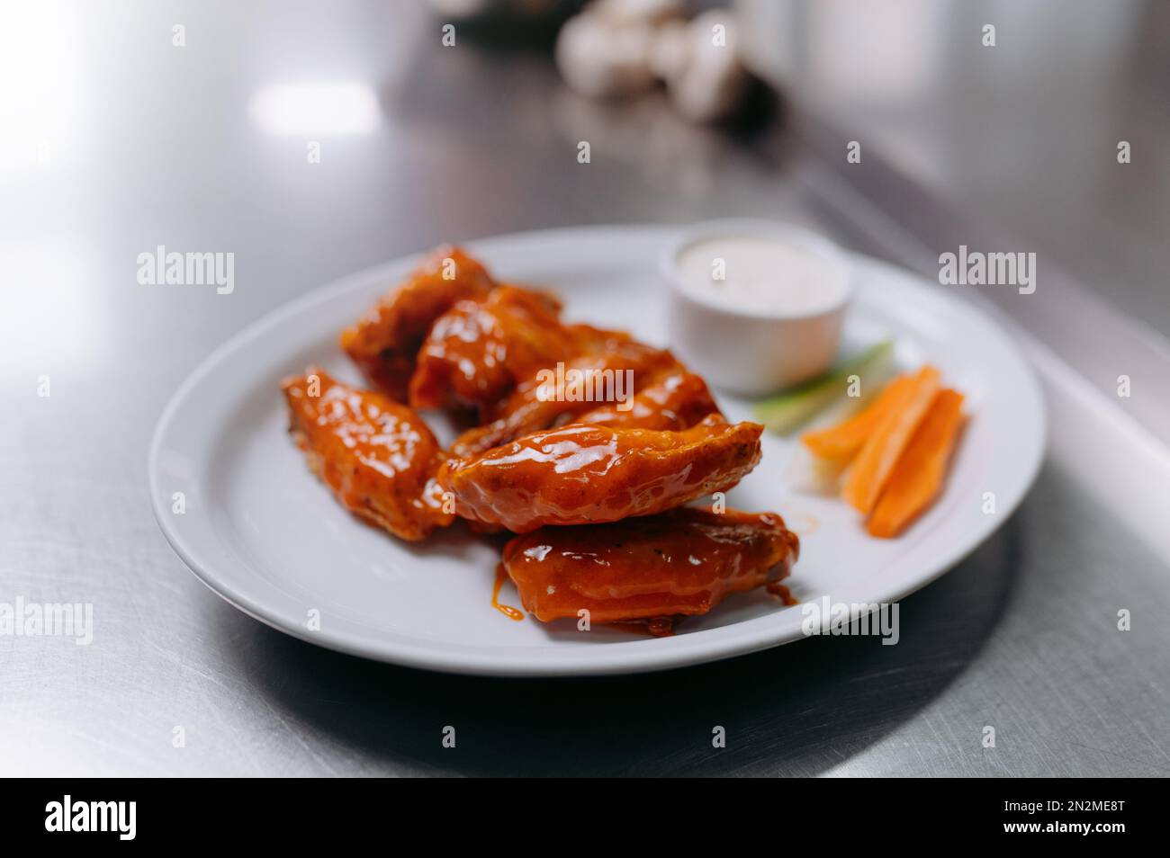 Mild Buffalo Chicken Wings.chicken wings in sauce Stock Photo - Alamy