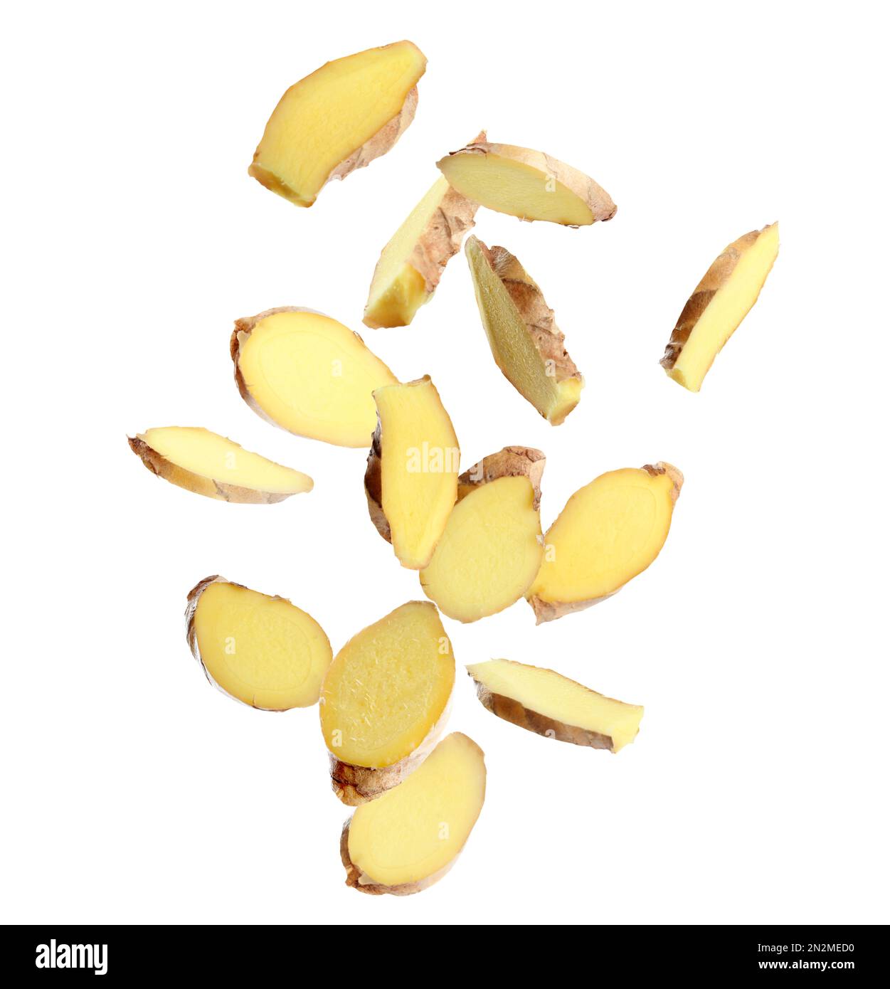 Fresh sliced ginger falling on white background Stock Photo - Alamy