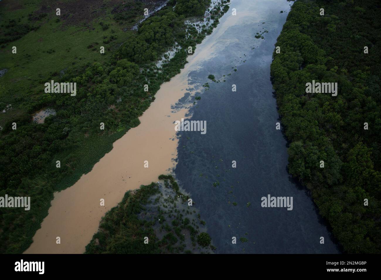 This aerial view show the polluted water channels that rim the Barra ...