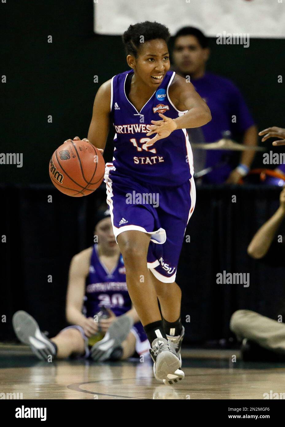 Northwestern State's Chelsea Rogers (12) moves the ball around the ...