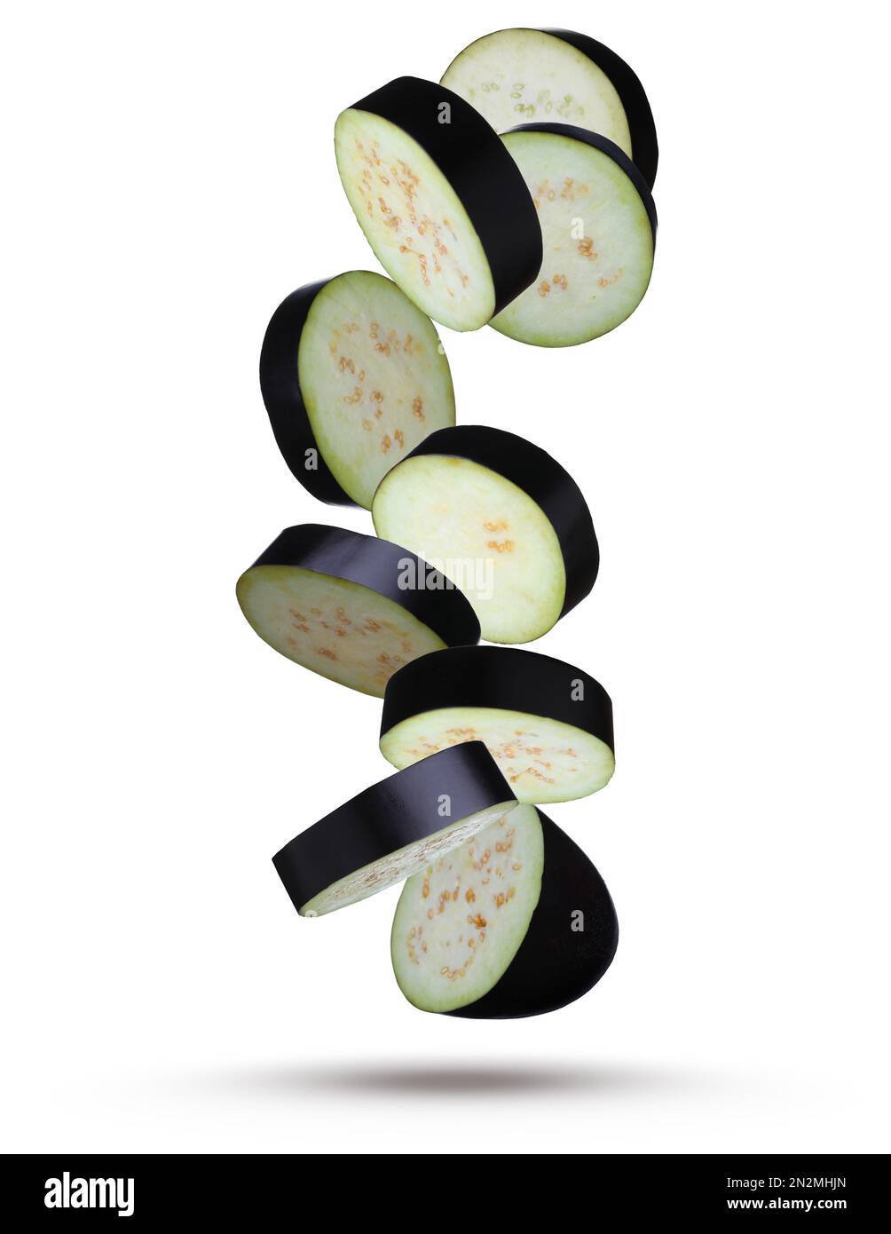 Cut fresh eggplant pieces falling on white background Stock Photo - Alamy