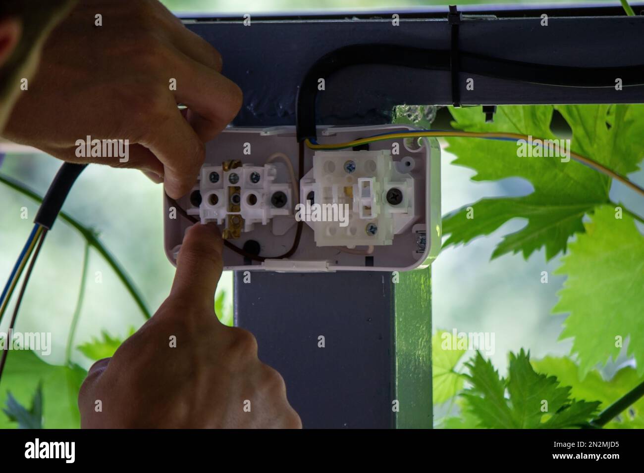 electrician to connect the outlet Stock Photo - Alamy