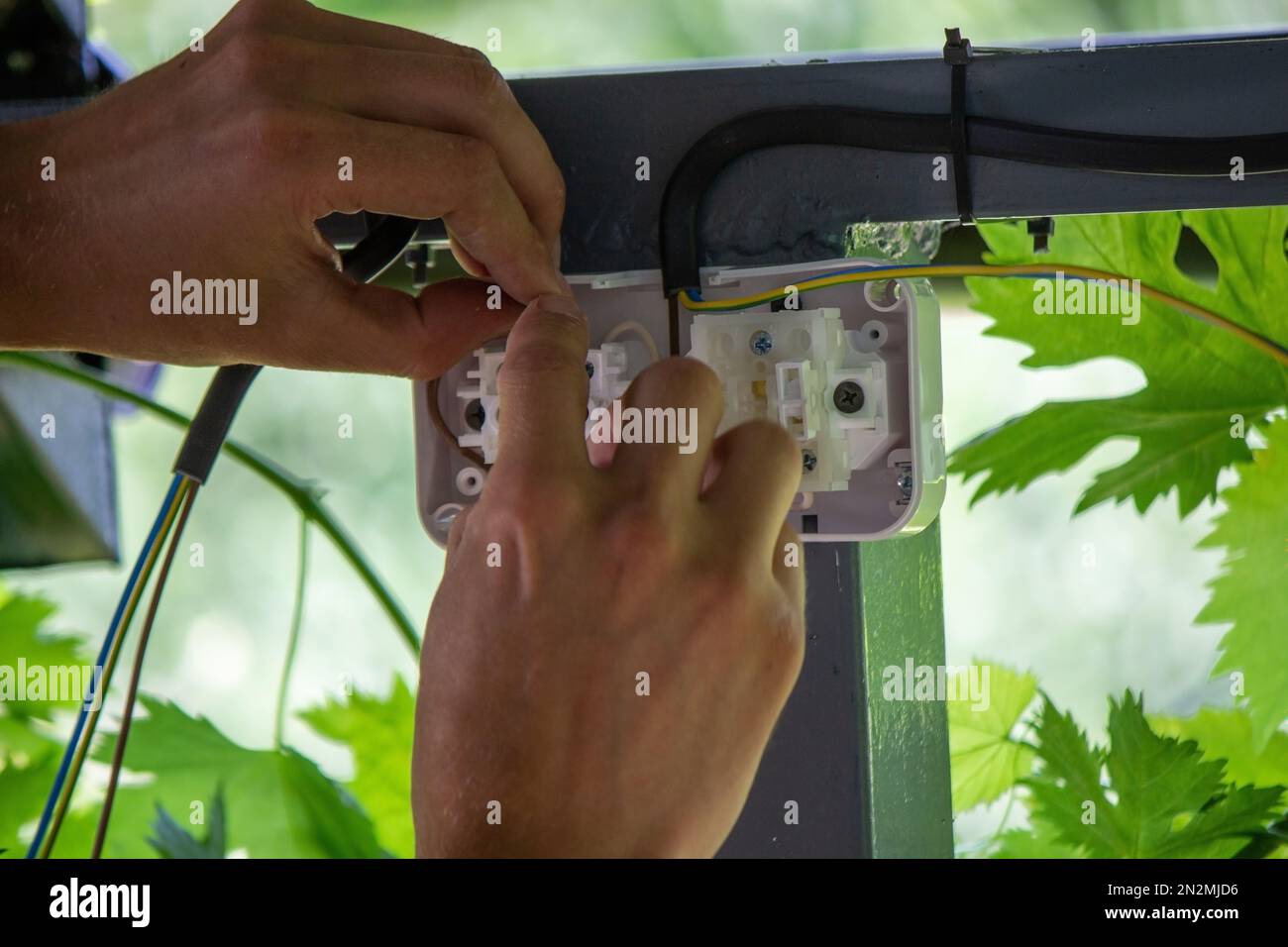 electrician to connect the outlet Stock Photo - Alamy