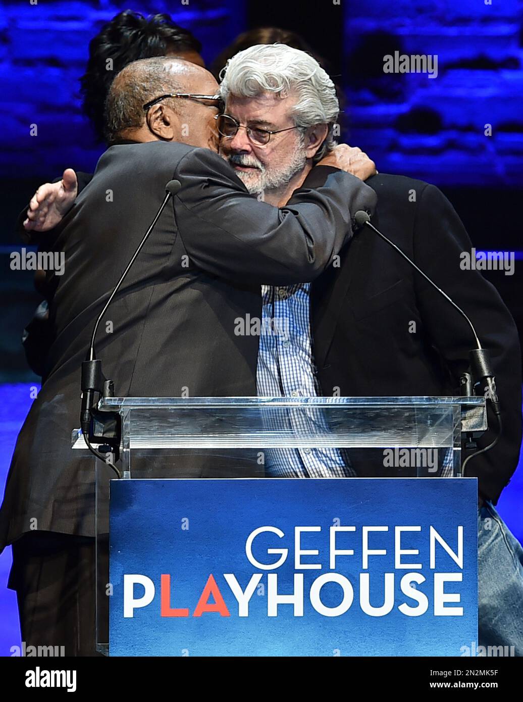 Quincy Jones, left, presents the distinction in service award to George ...