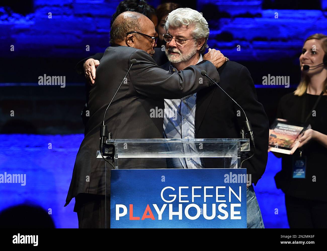 Quincy Jones, left, presents the distinction in service award to George ...