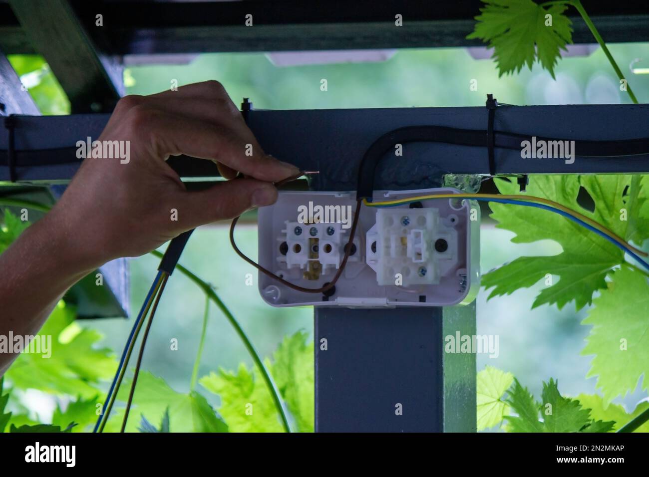 electrician to connect the outlet Stock Photo - Alamy