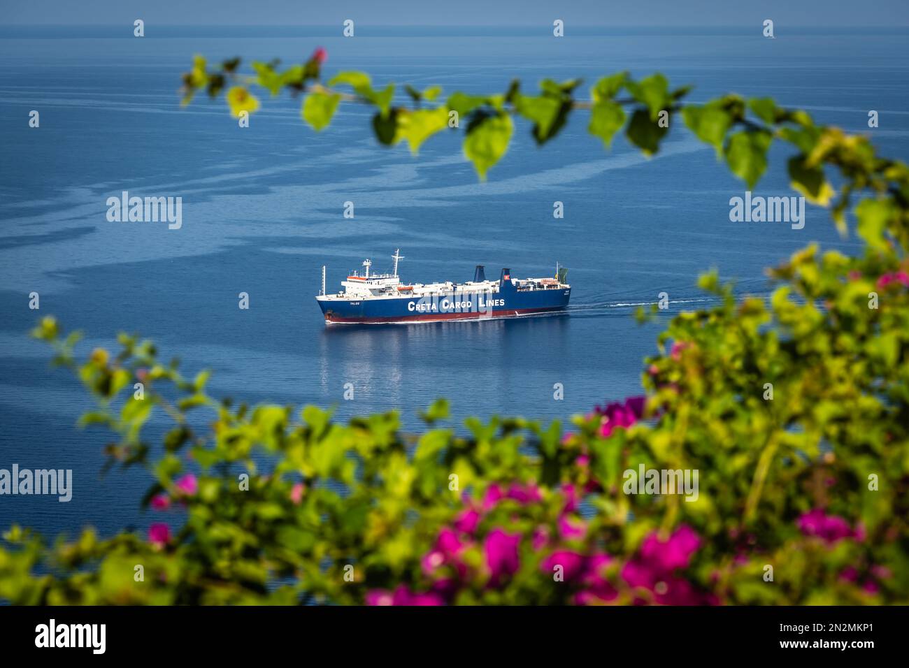 Santorini, Greece - August 2022 : Huge cargo ship on the water of ...