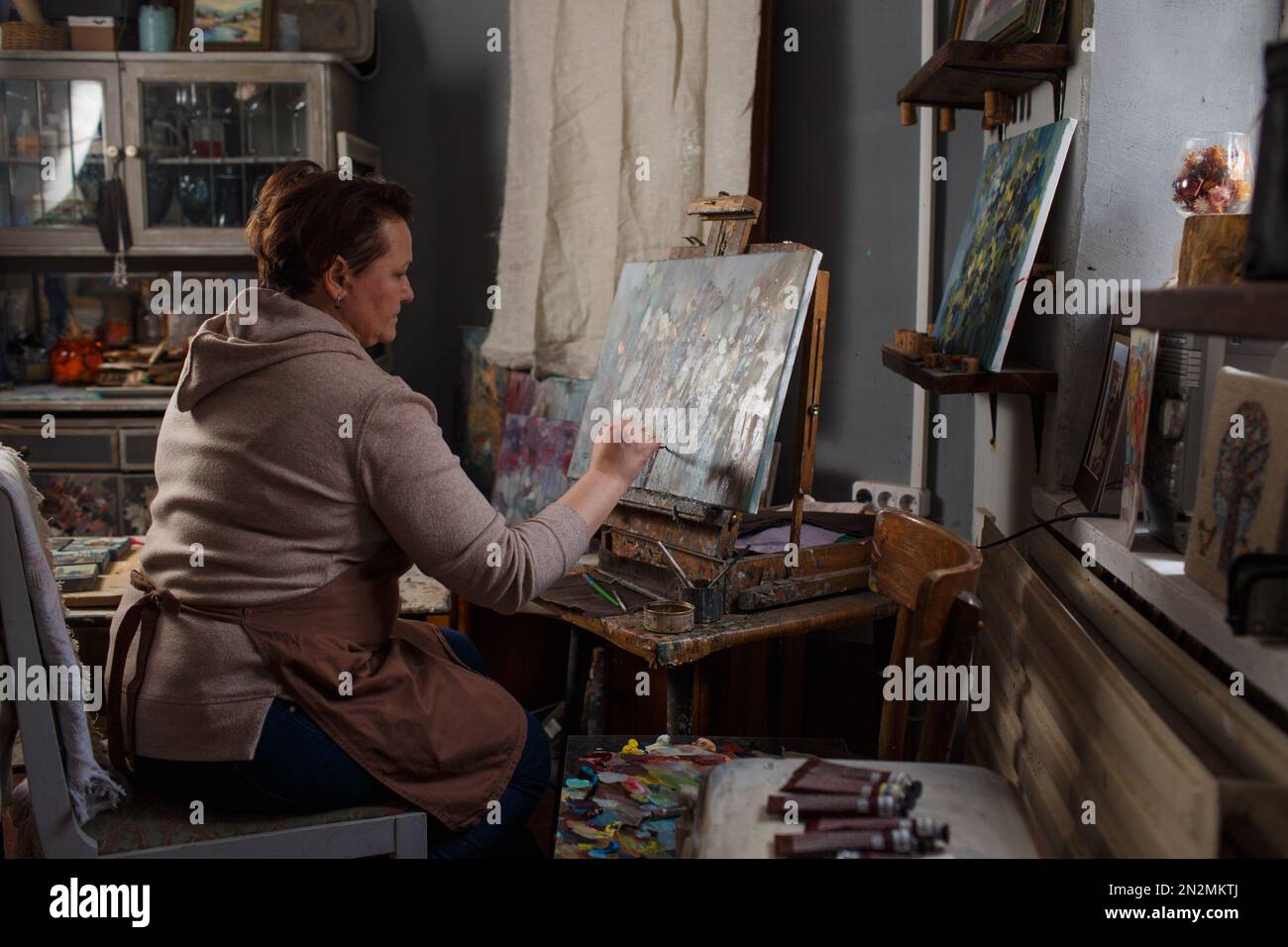 Professional artist engaged in drawing hi-res stock photography and ...