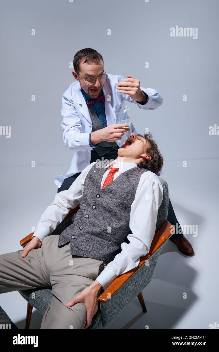 Crazy insane doctor, dentist putting many various pills into female's ...