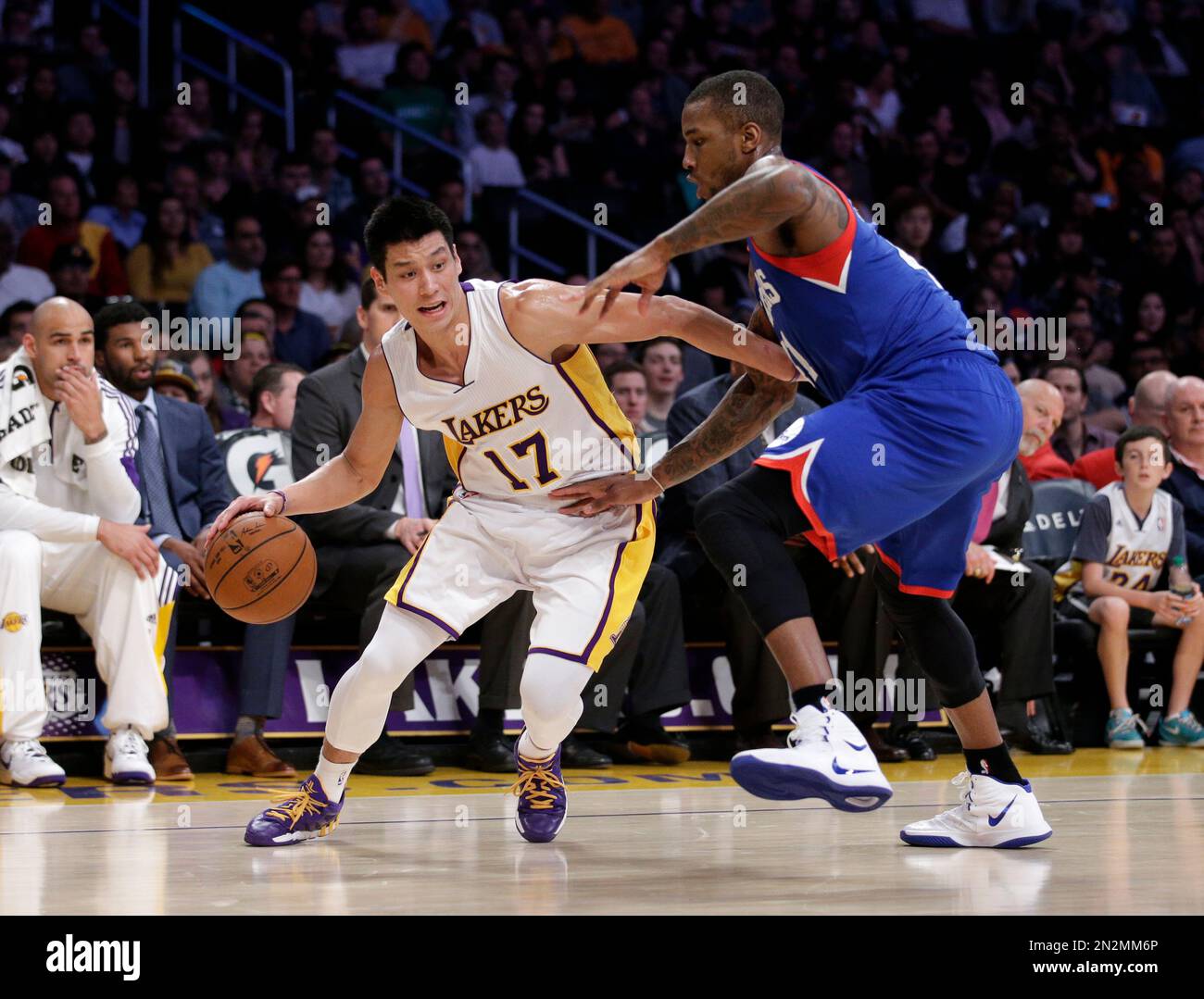 Los Angeles Lakers' Jeremy Lin, left, drives past Philadelphia 76ers ...