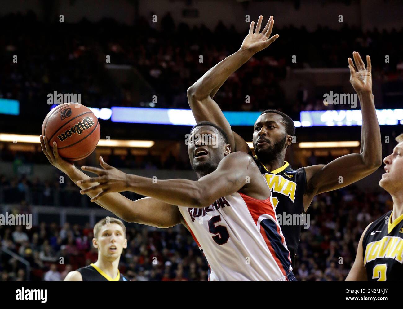Gonzaga's Gary Bell Jr. (5) shoots as Iowa's Gabriel Olaseni defends ...