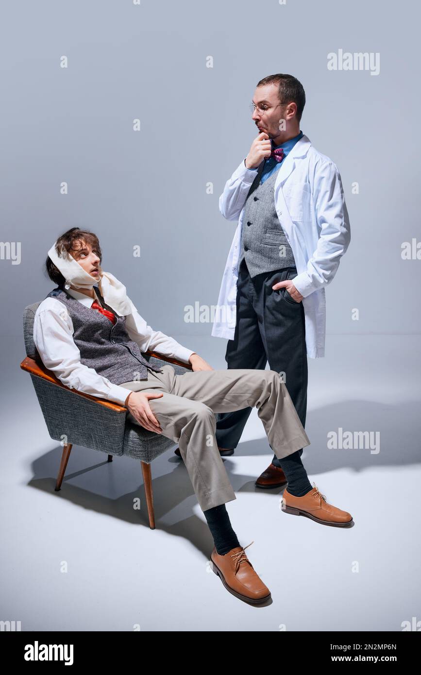 Questioning face. Young man with tooth pains visiting dentist, doctor ...