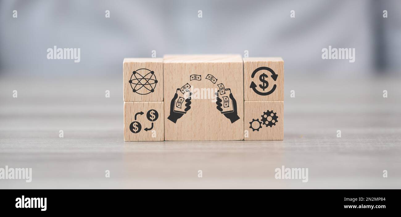 Wooden blocks with symbol of money transfer concept Stock Photo - Alamy