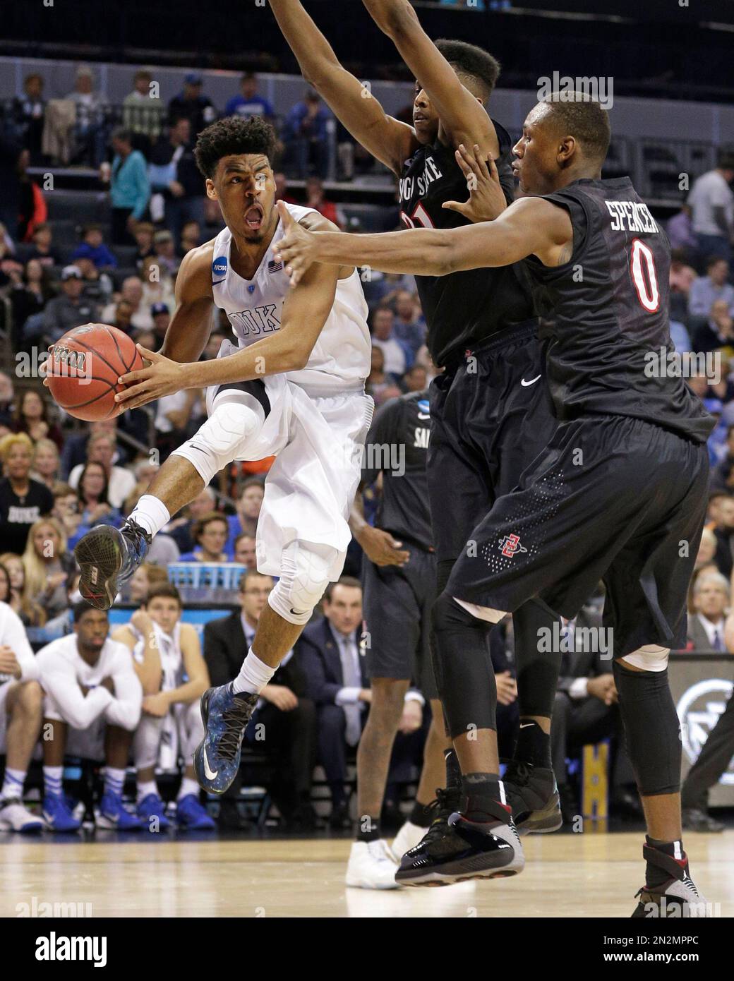 Duke's Quinn Cook, left, looks to pass as San Diego State's Skylar ...