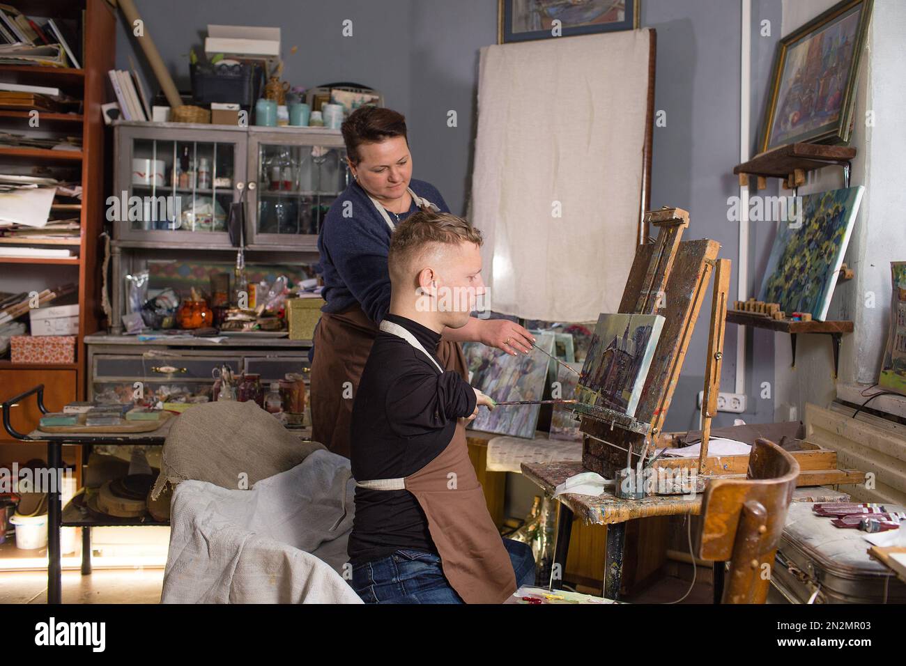 Professional artist engaged in drawing hi-res stock photography and ...