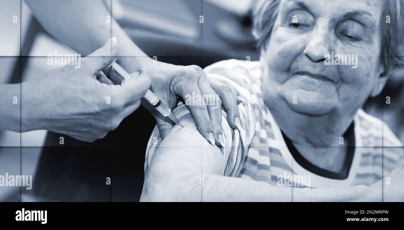 Nurse giving an injection to senior woman, geometric pattern Stock ...