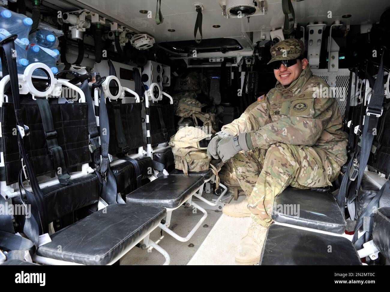 US Army's Staff Sergeant Michael Hinkle smiles inside a Stryker vehicle ...