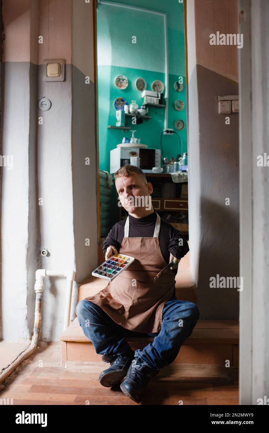 Young man disabilities paints hi-res stock photography and images - Alamy