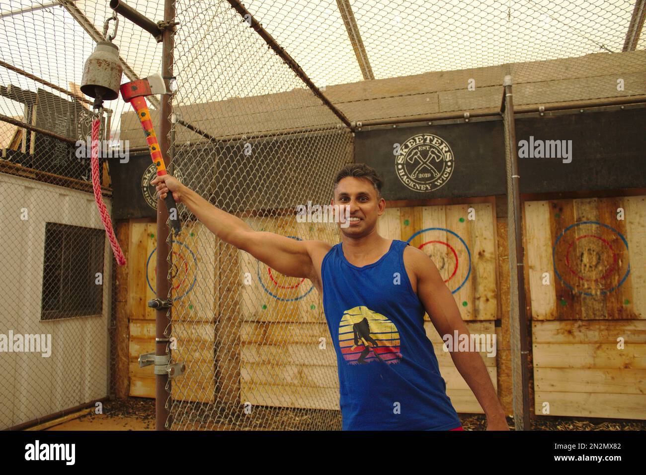 Axe throwing man Stock Photo - Alamy