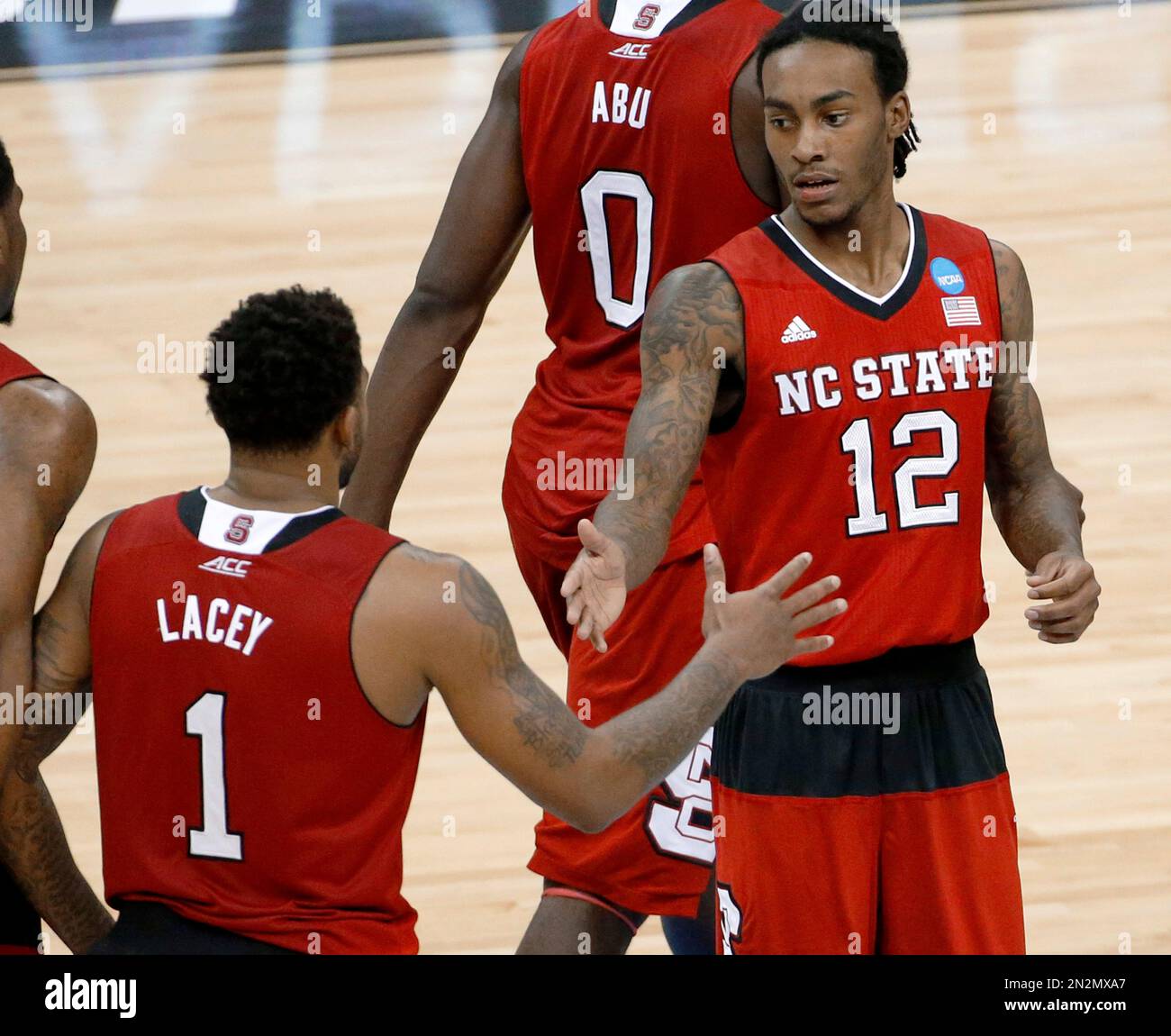 North Carolina State's Anthony Barber (12) greets Trevor Lacey (1 ...