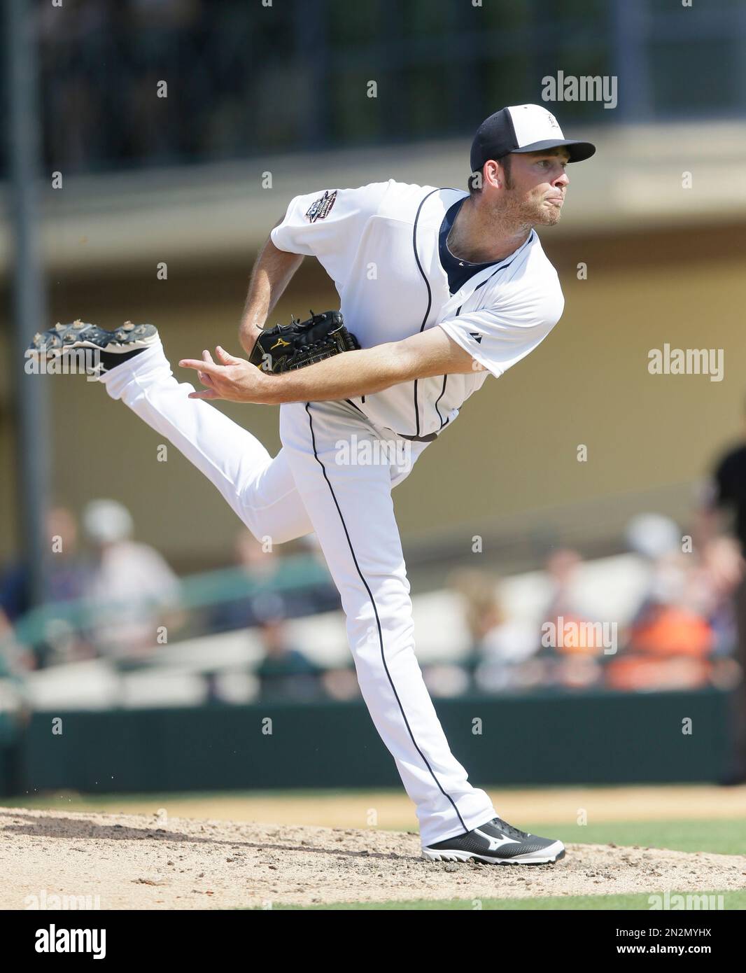 Detroit Tigers pitcher Kyle Ryan throws during the a spring training ...
