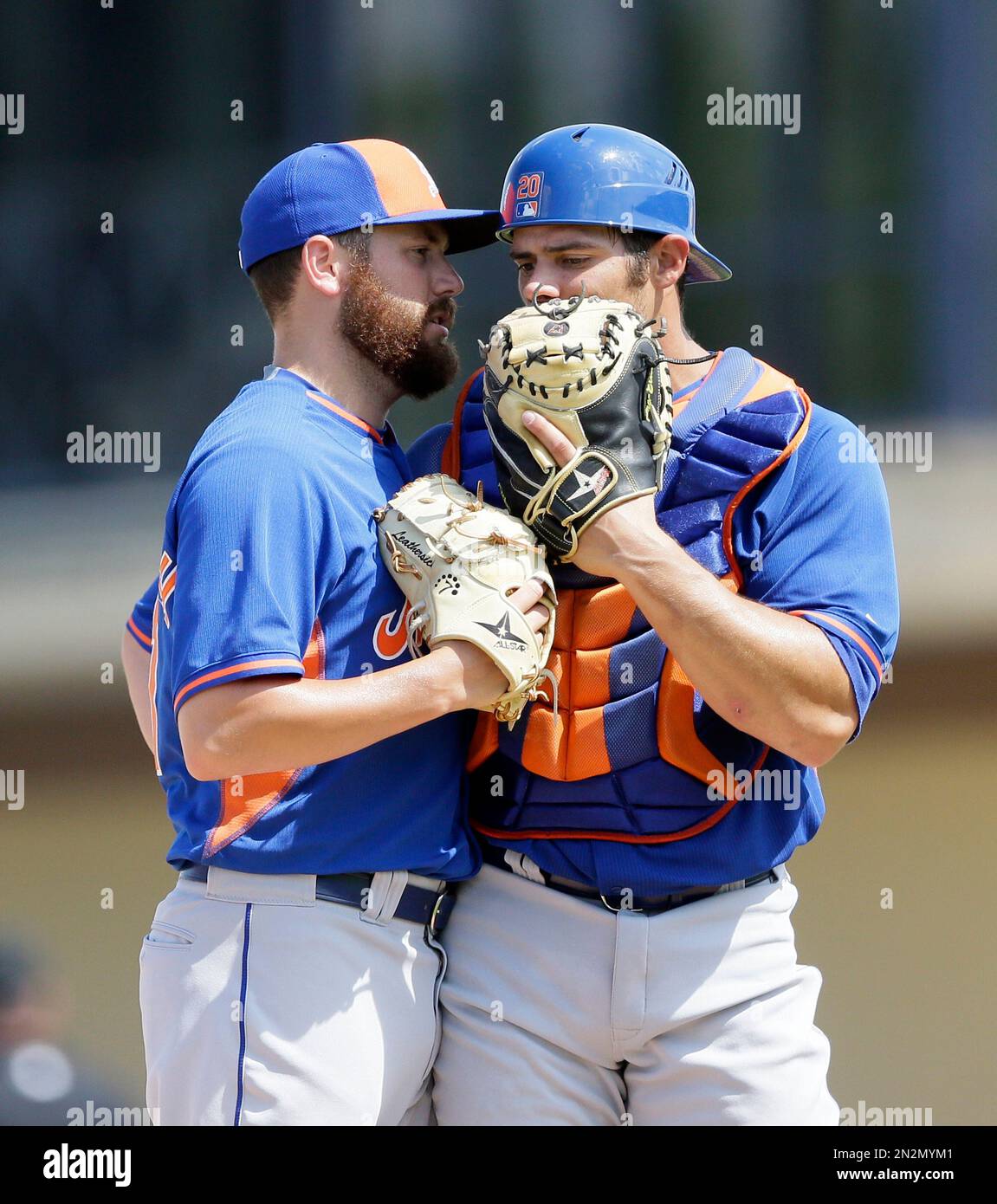 New York Mets pitcher Jack Leathersich, left, talks with catcher ...