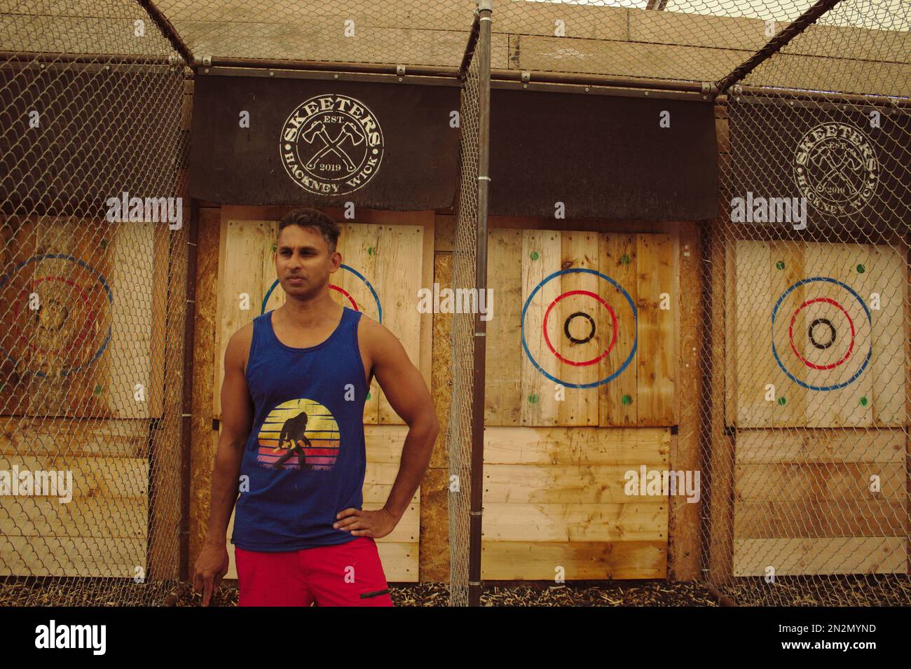 Axe throwing man Stock Photo - Alamy
