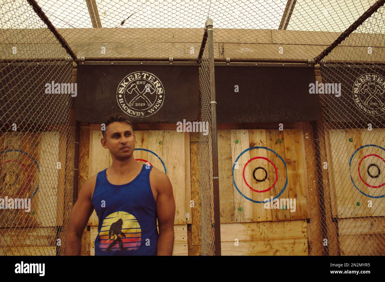 Axe throwing man Stock Photo - Alamy