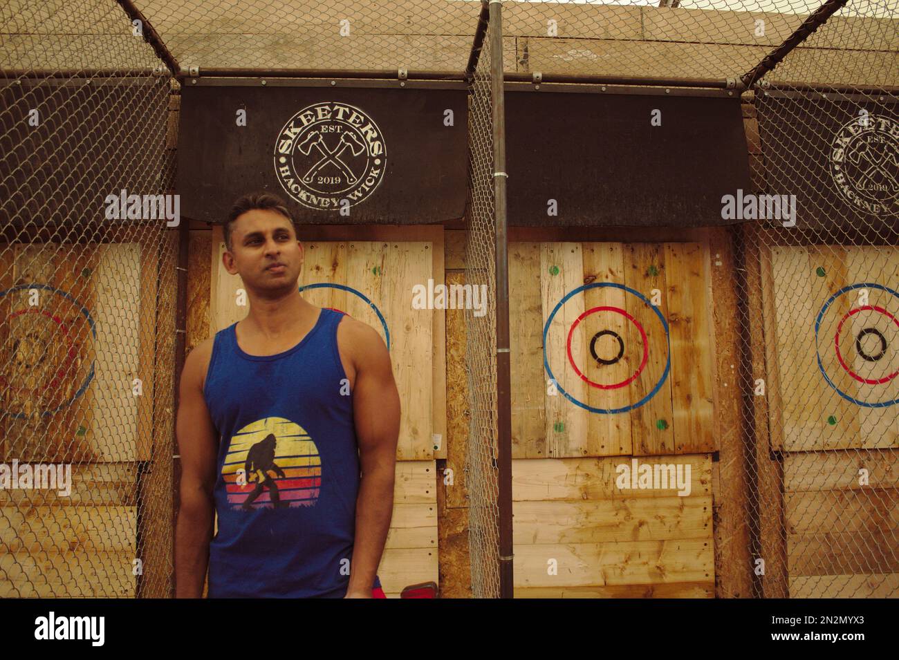 Axe throwing man Stock Photo - Alamy