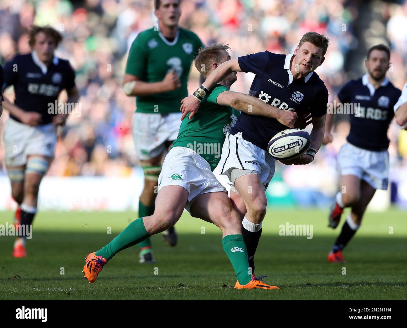 Scotland's Finn Russell, right, is tackled by Ireland's Luke Fitzgerald ...