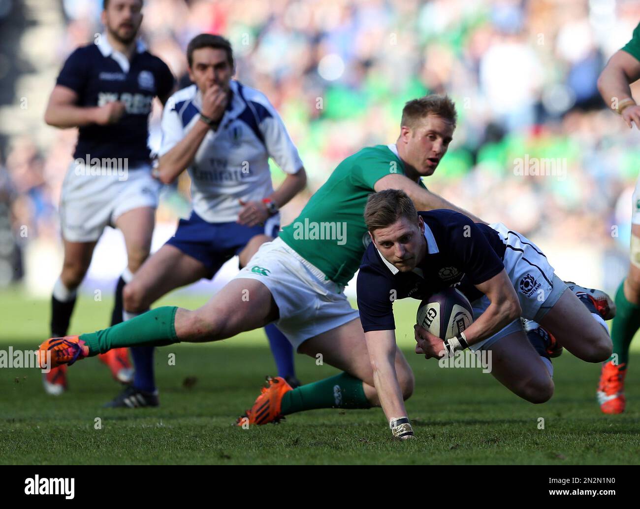 Scotland's Finn Russell, right, is tackled by Ireland's Luke Fitzgerald ...