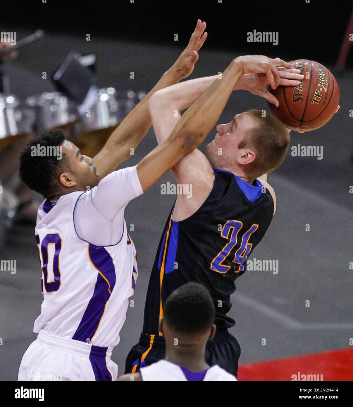 Madison East's Cortland Cuevas, left, blocks out Germantown's Maxwell ...