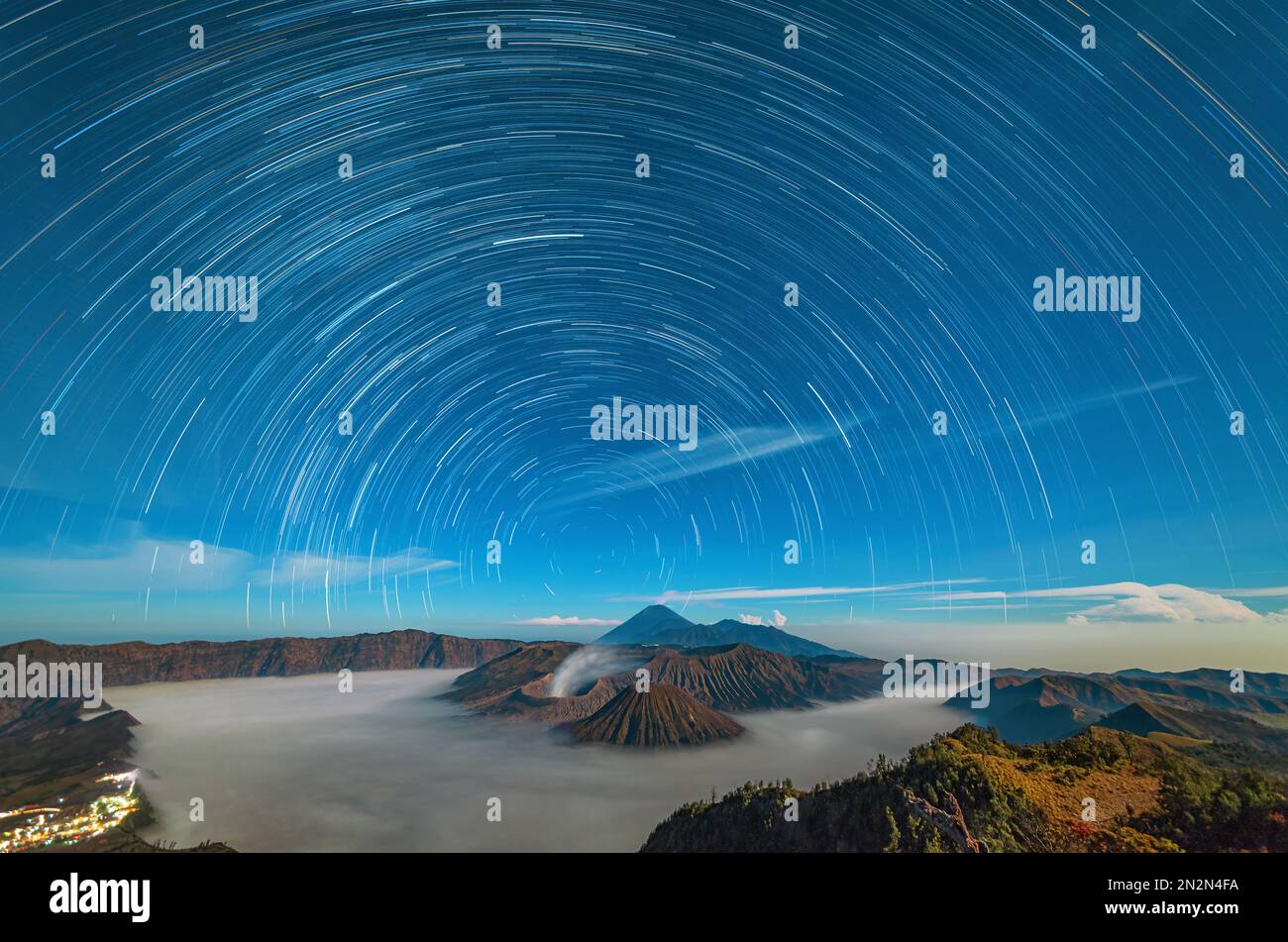 Star trails over the volcano. Clouds. Night Stock Photo - Alamy
