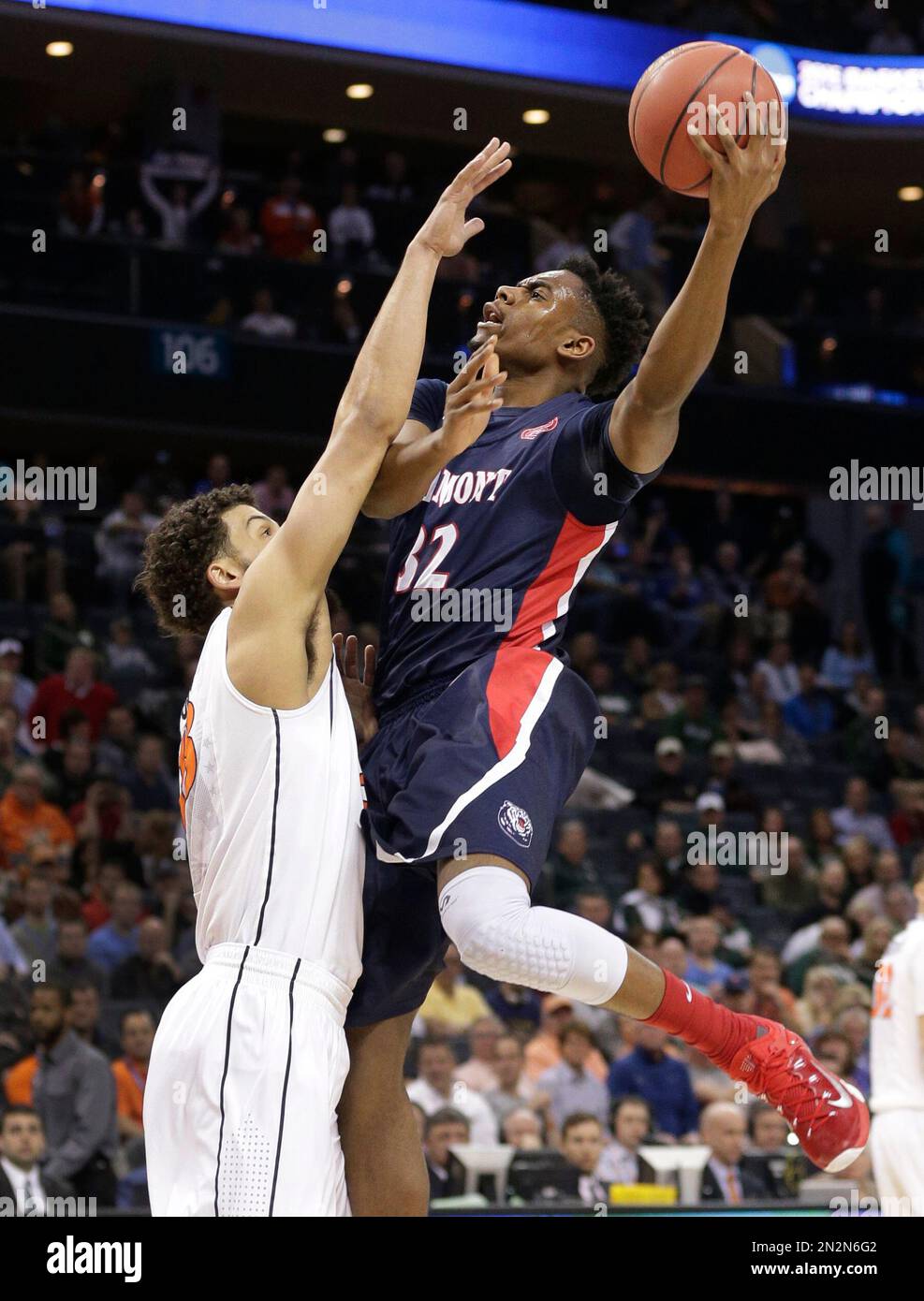 Belmont's Amanze Egekeze, right, drives against Virginia's Anthony Gill ...