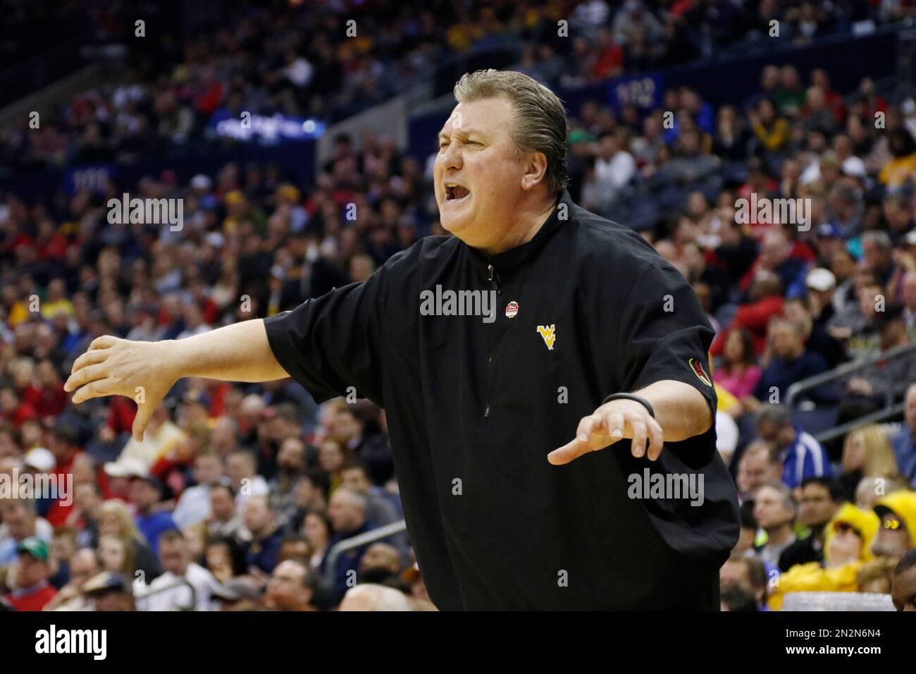 West Virginia head coach Bob Huggins objects to a call in the first ...