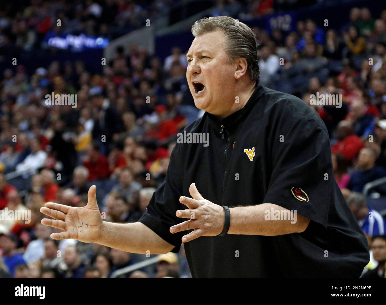 West Virginia head coach Bob Huggins objects to a call in the first ...