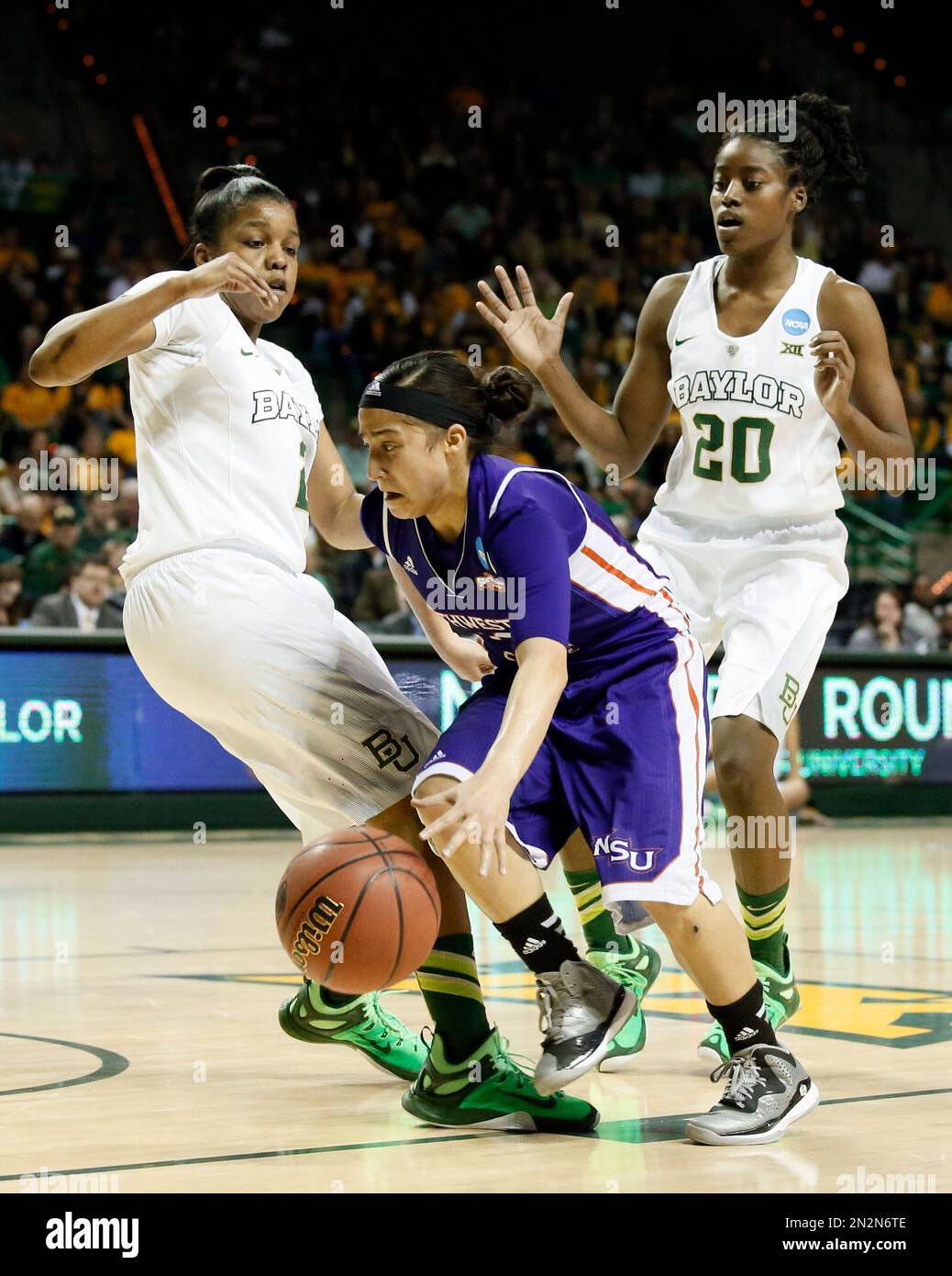 Baylor's Niya Johnson, left, and Imani Wright (20) defend as ...