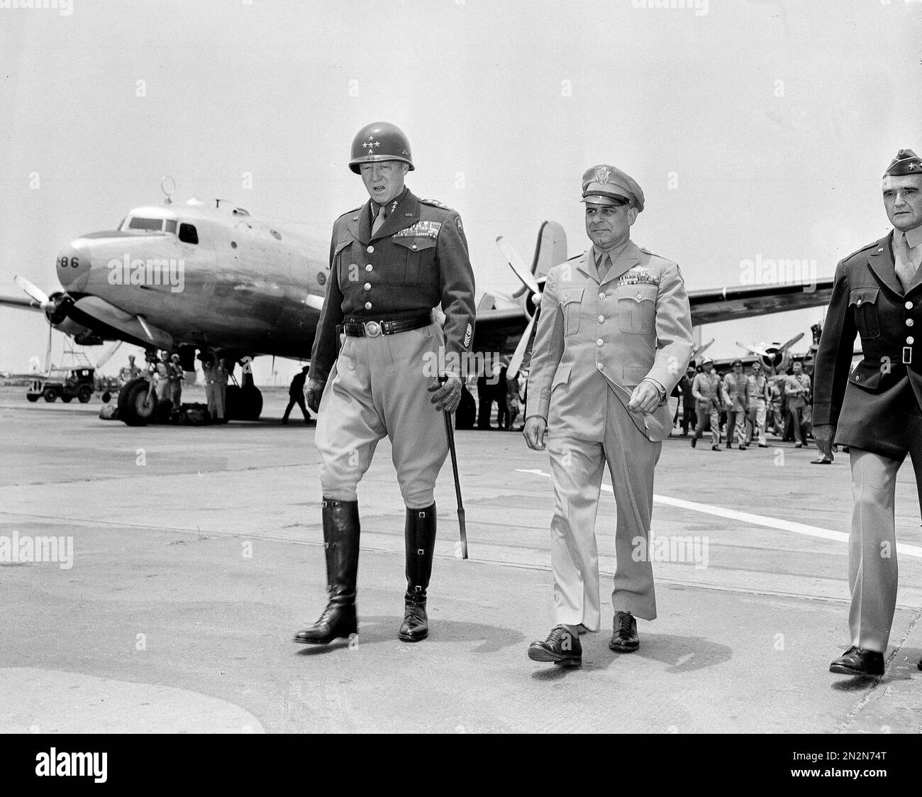 Generals George S. Patton Jr., left, and James H. Doolittle walk to ...