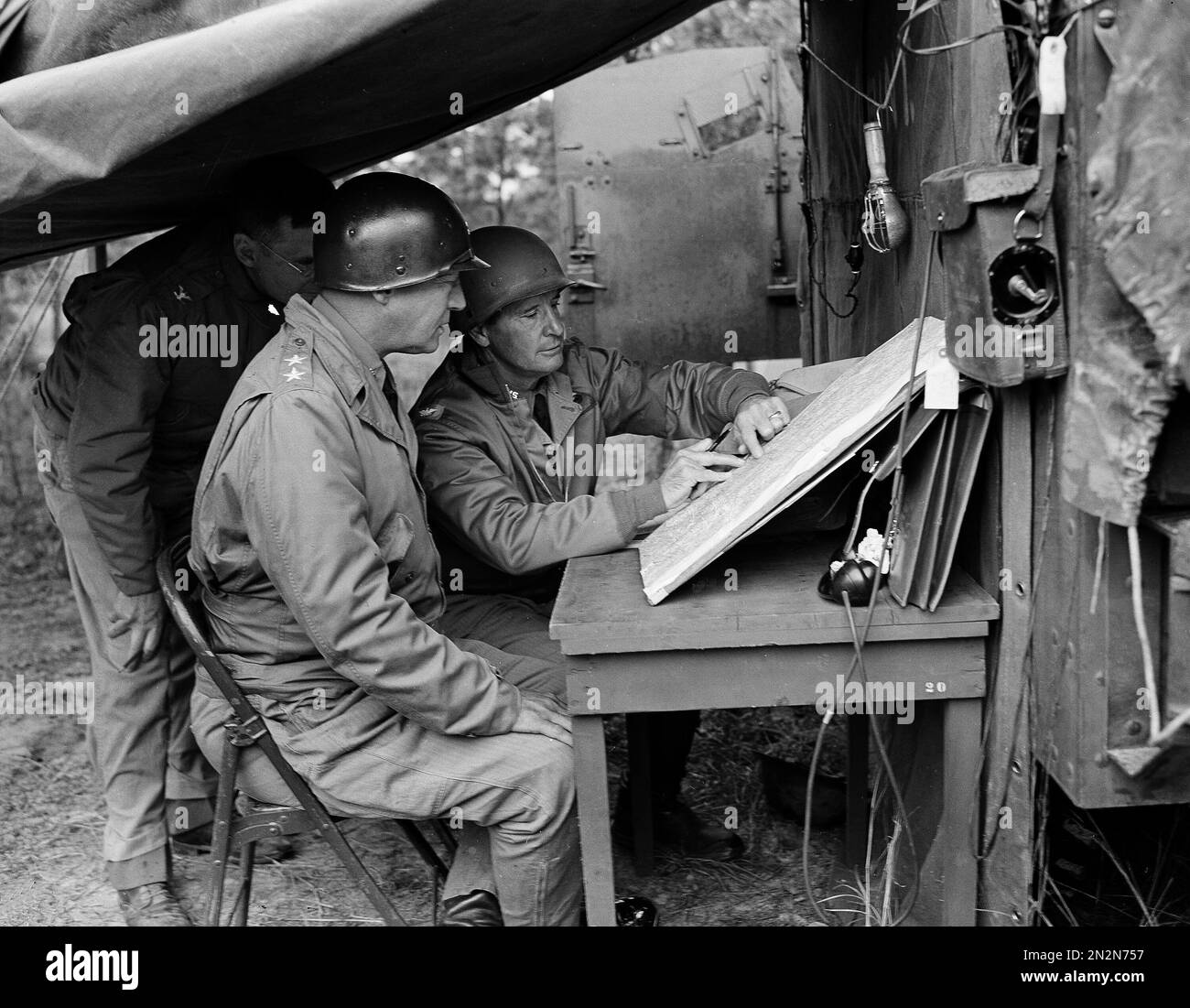 Maj. Gen. George S. Patton Jr., left, commanding the Second Armored ...