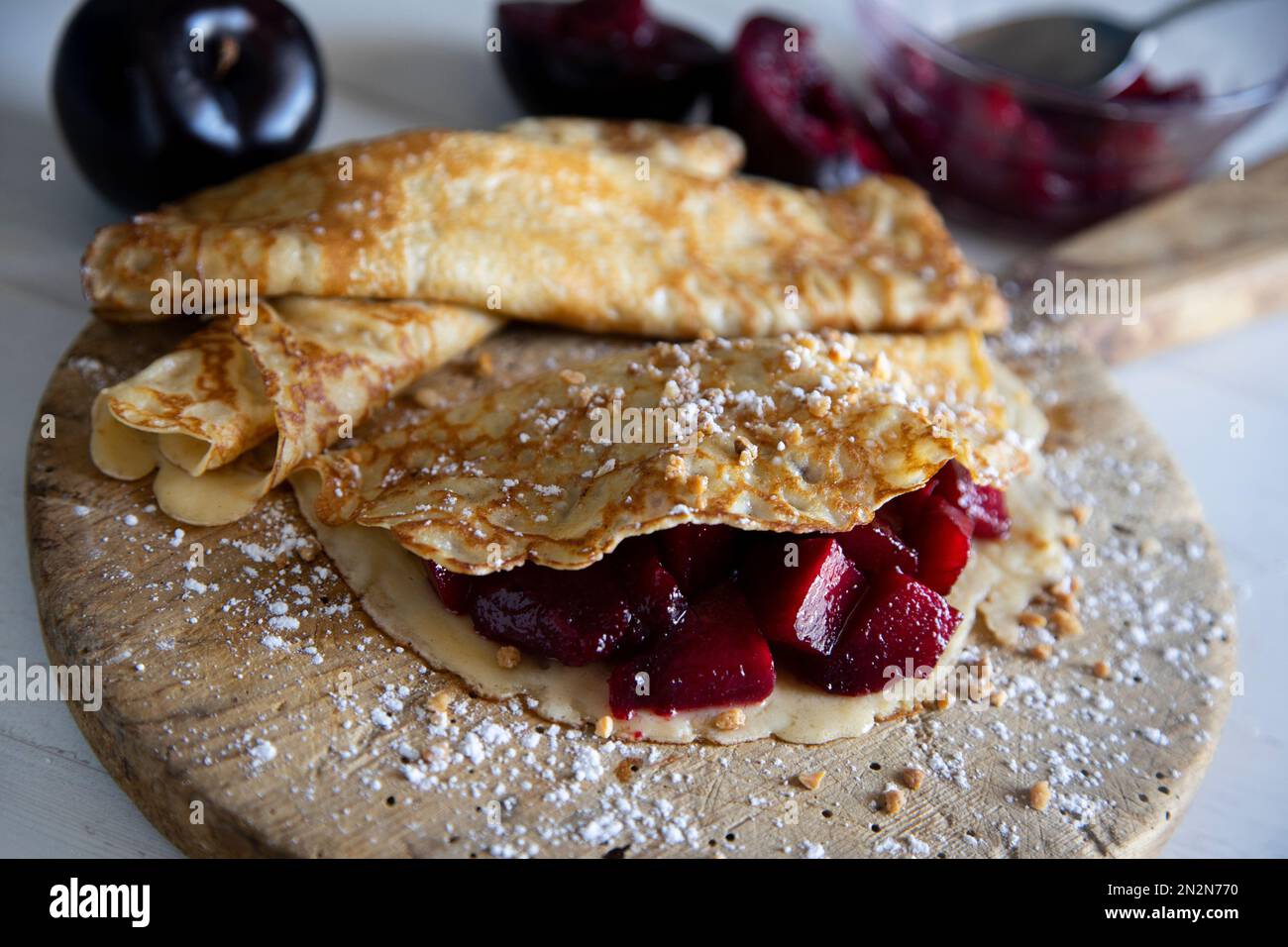 French crepes with plum and fresh fruit Stock Photo - Alamy