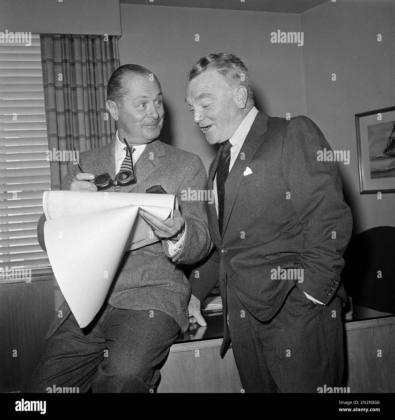 Robert Montgomery, left, back at MGM where he started his road to fame ...