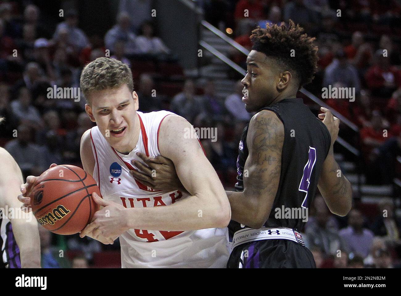 Stephen F. Austin guard Ty Charles, right, plays tight defense against ...