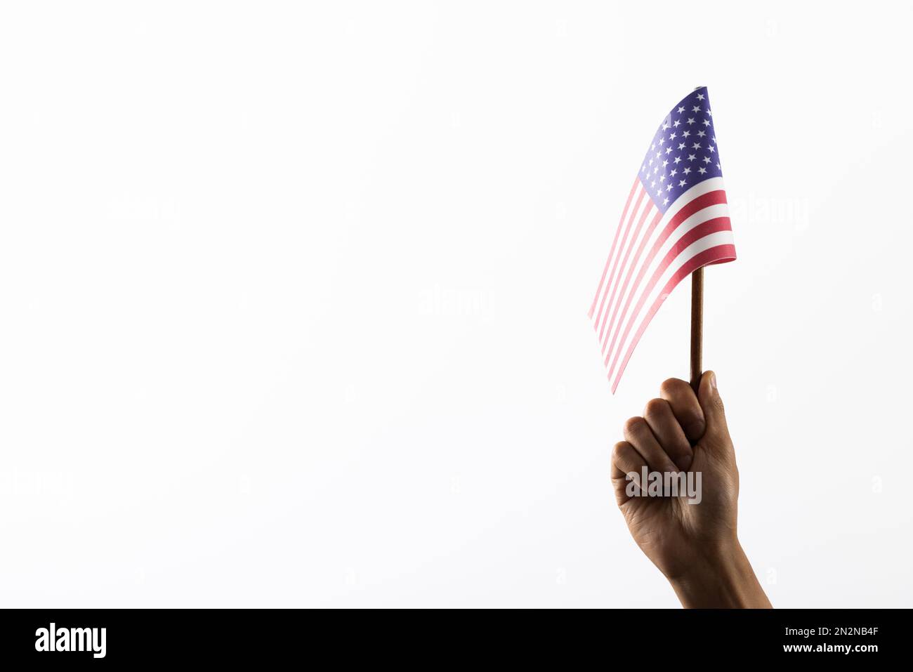 Hand holding flag pole of usa on white background with copy space Stock ...
